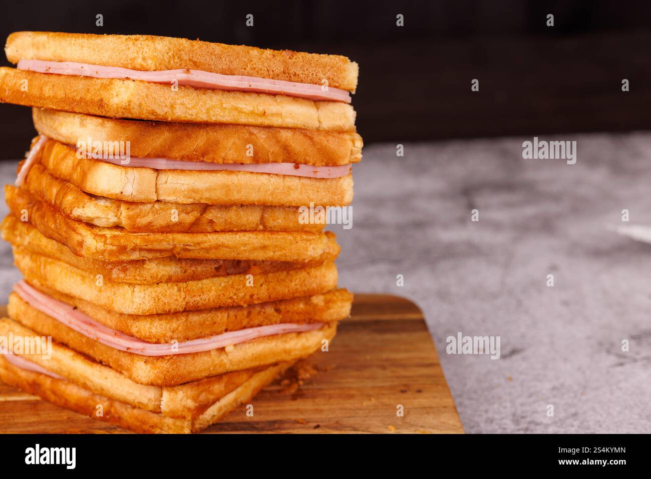 A delightful arrangement of ham and cheese sandwiches cut in half ...