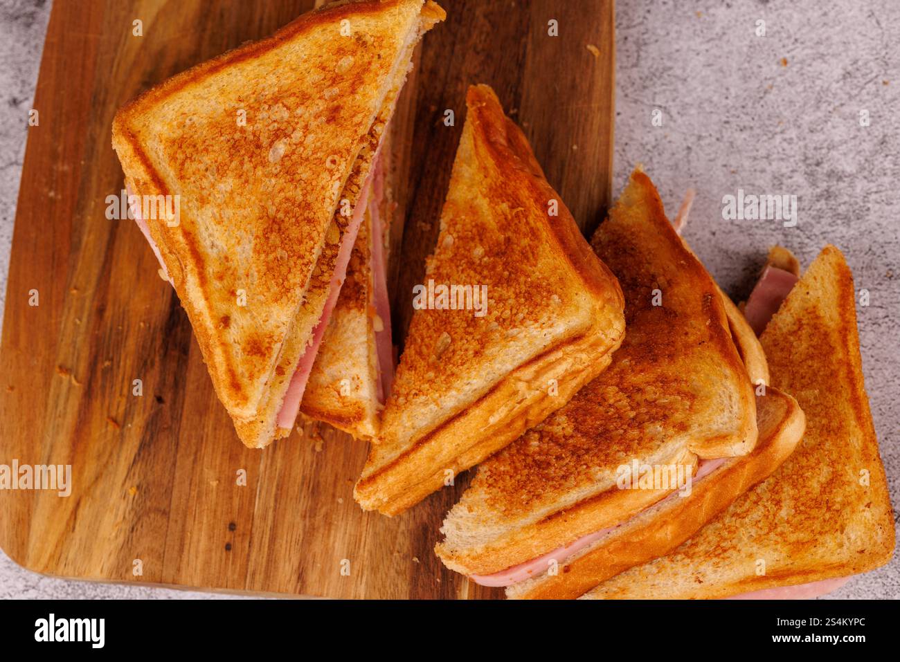 A delightful arrangement of ham and cheese sandwiches cut in half ...