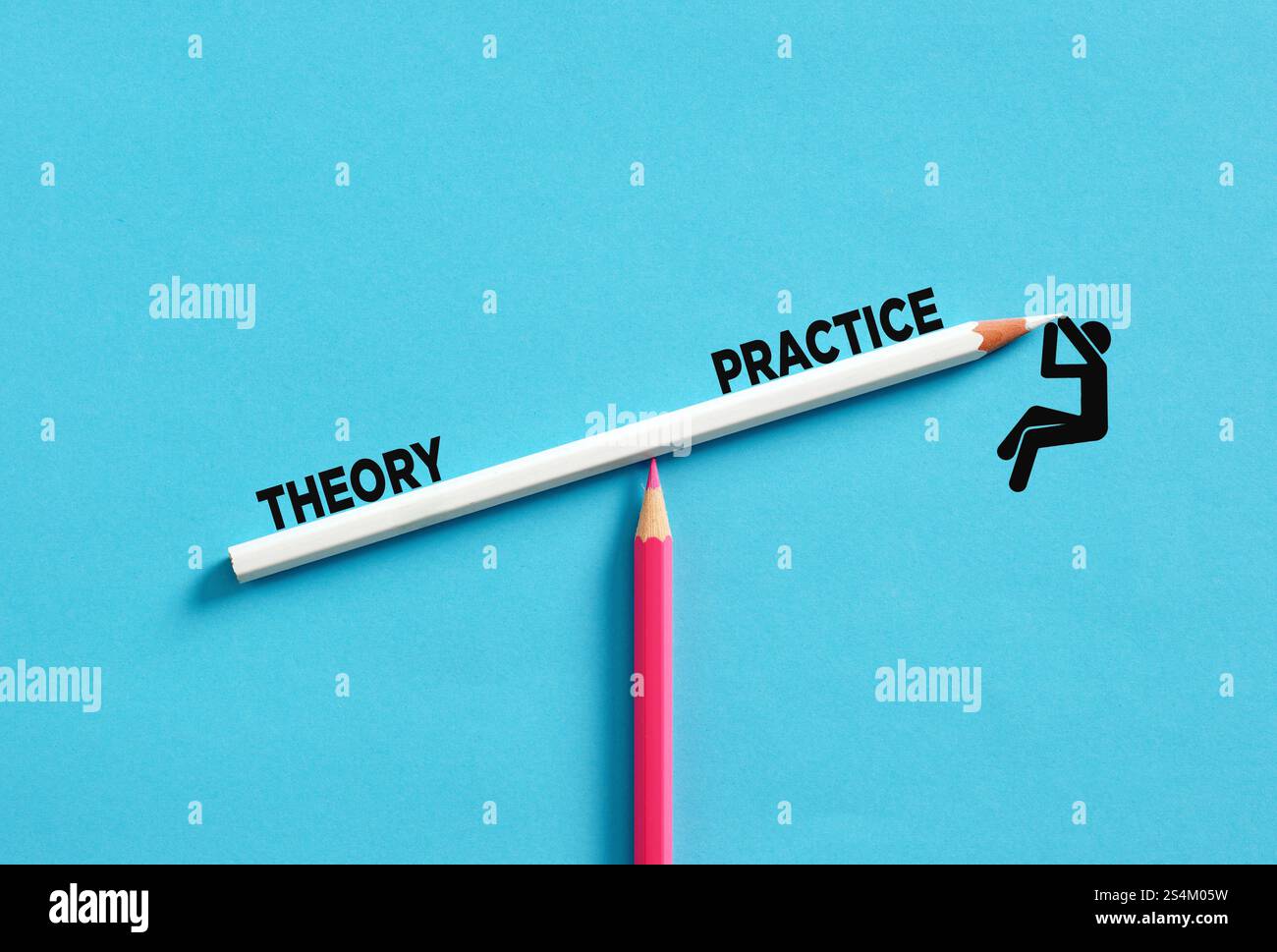 Trying to balance theory with practice. Education concept Stock Photo ...