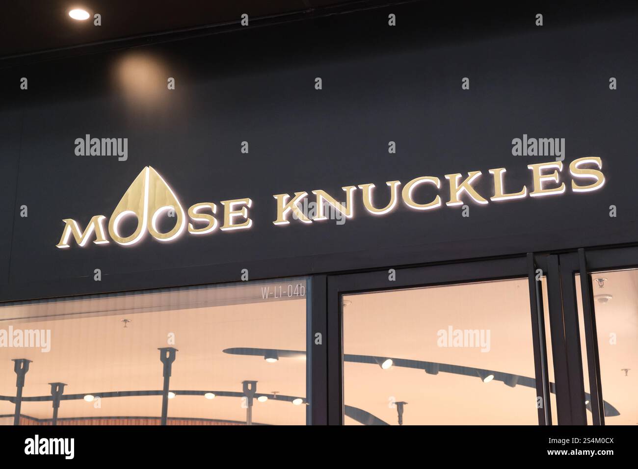 Moose Knuckles brand logo store sign Stock Photo - Alamy