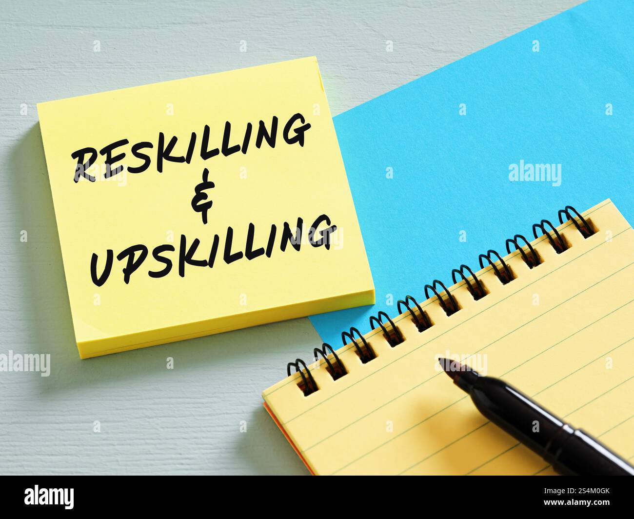 Sticky note with reskilling and upskilling handwritten, education and ...