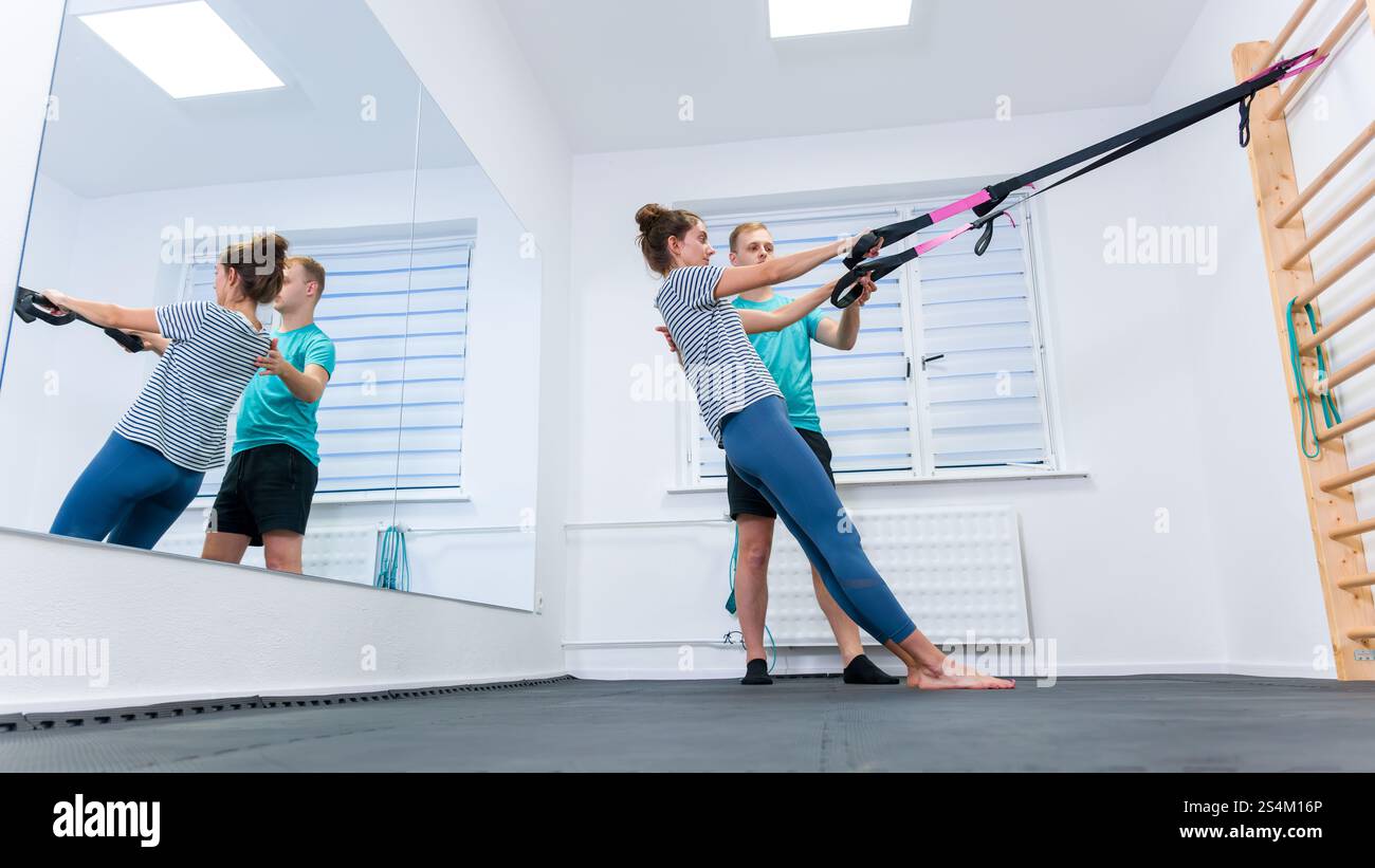 Woman with shoulder pain in physical therapy. Physical therapist ...