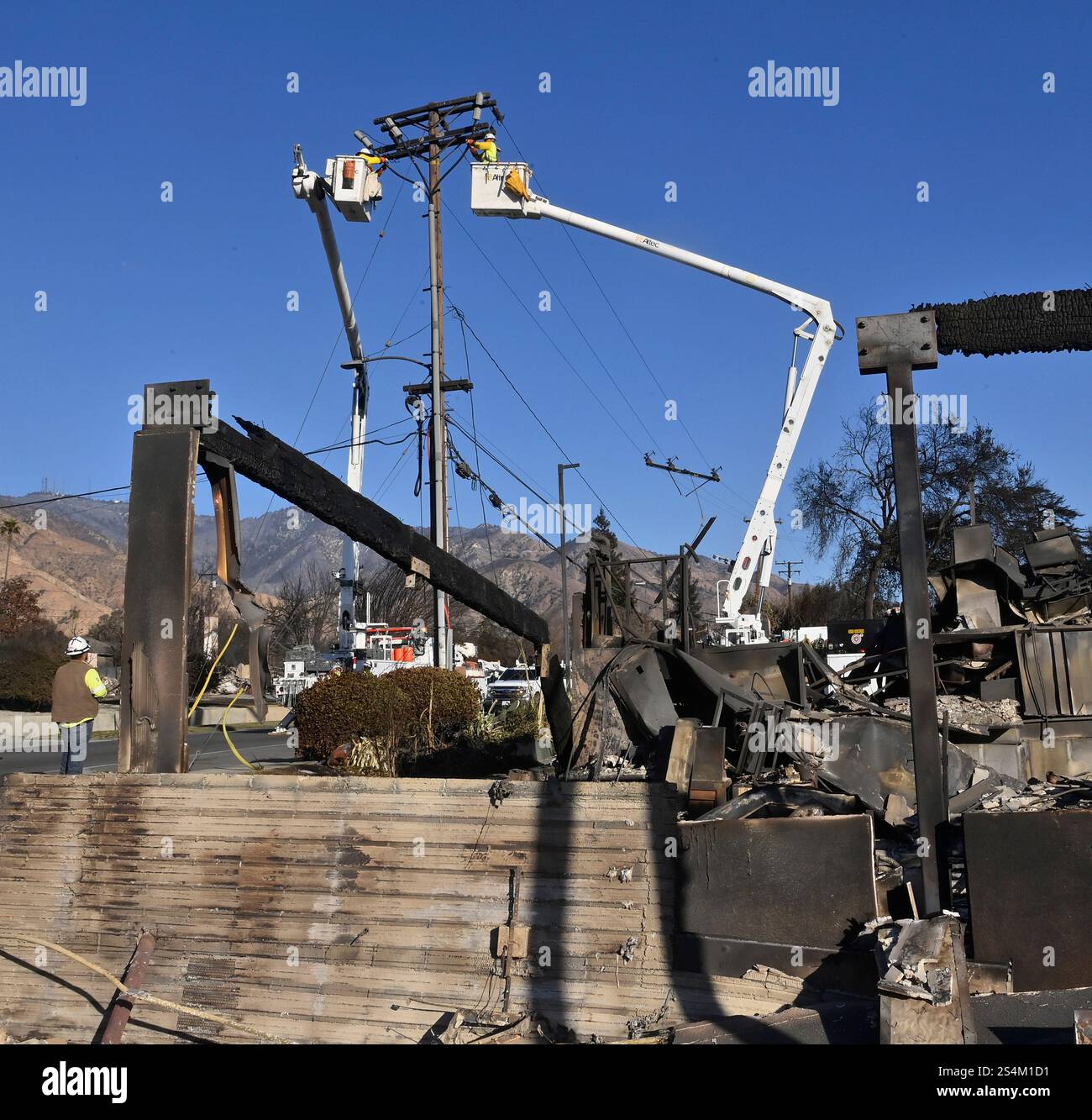 Los Angeles, United States. 12th Jan, 2025. Utility workers repair ...