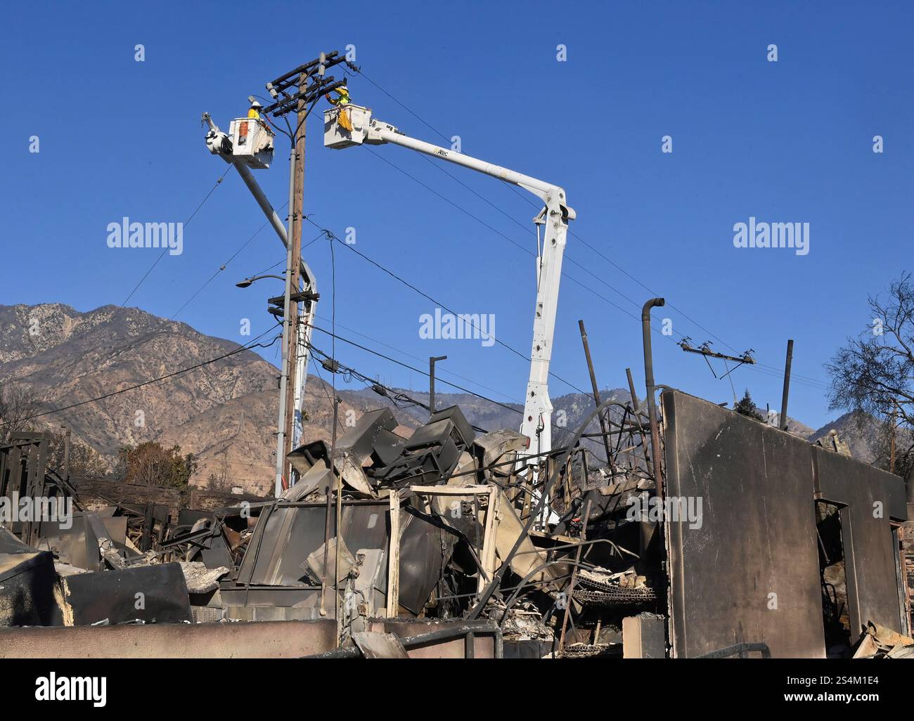 Los Angeles, United States. 12th Jan, 2025. Utility workers repair ...