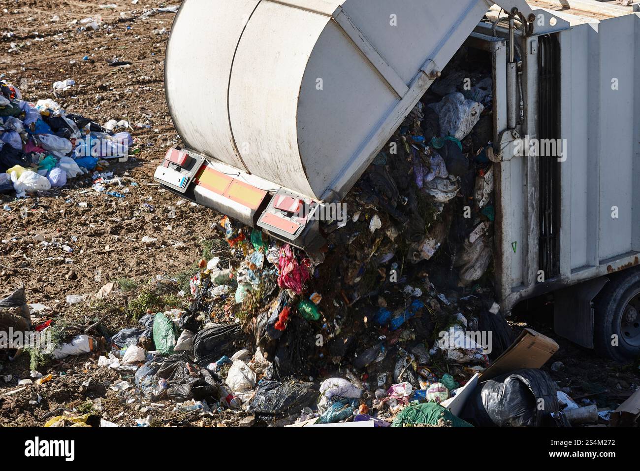 Truck unloading garbage on an open air dump. Waste recycling Stock ...