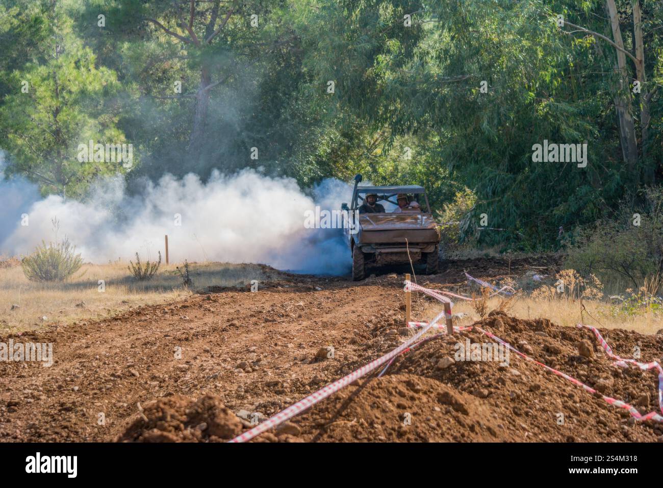 intensity of an off-road race. A rugged vehicle, enveloped in a cloud ...