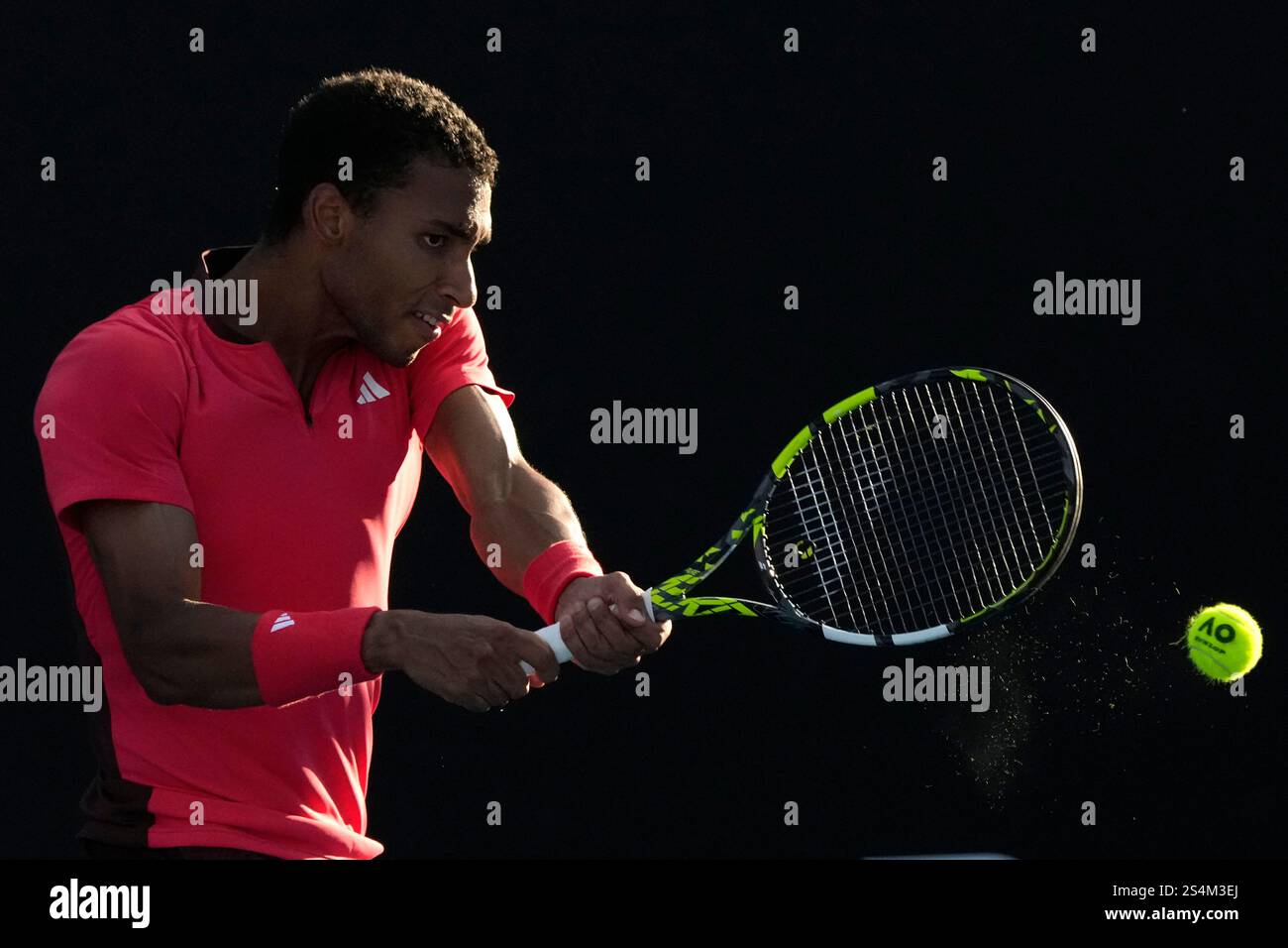 Felix Auger-Aliassime of Canada plays a backhand return to Jan-Lennard Struff of Germany during ...