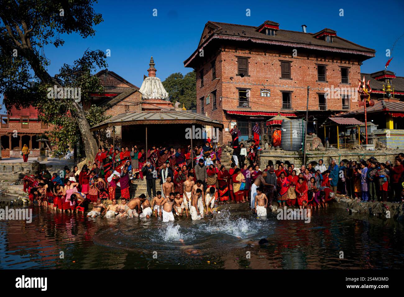 Kathmandu, Kathmandu, Nepal. 13th Jan, 2025. Devotees immerse ...