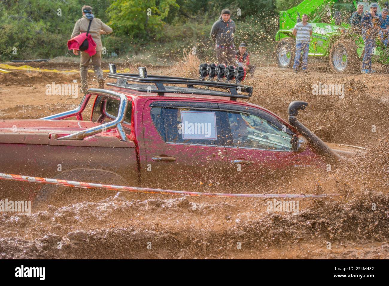 thrill of off-road racing red suv truck passing through mud pool Stock ...