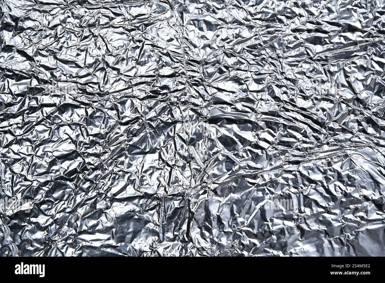 Foil crumpled textured metallic silver foil background Stock Photo - Alamy