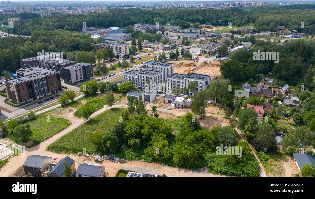 Aerial view of a suburban area with modern apartment buildings, houses ...