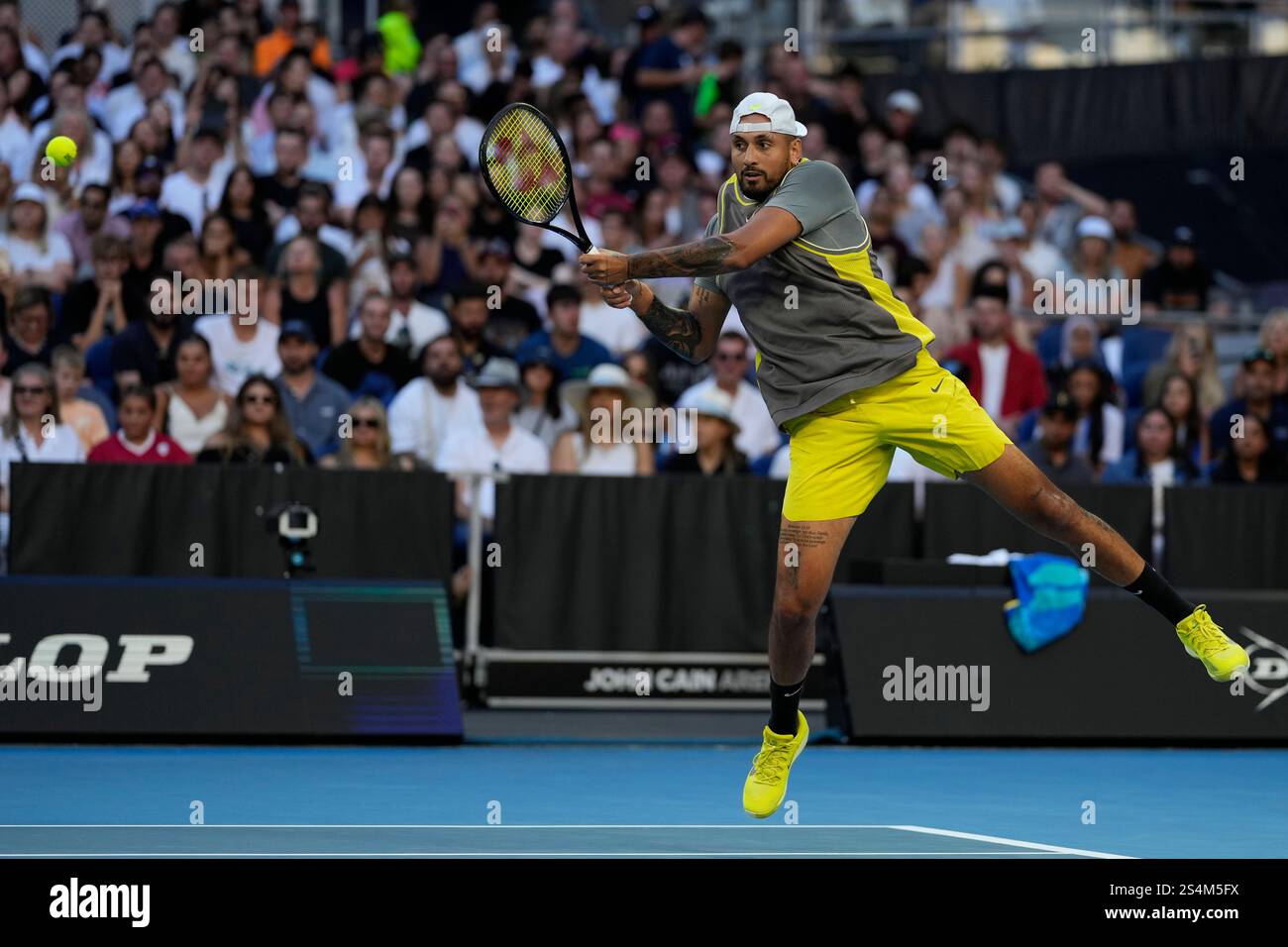 Nick Kyrgios of Australia plays a backhand return to Jacob Fearnley of ...