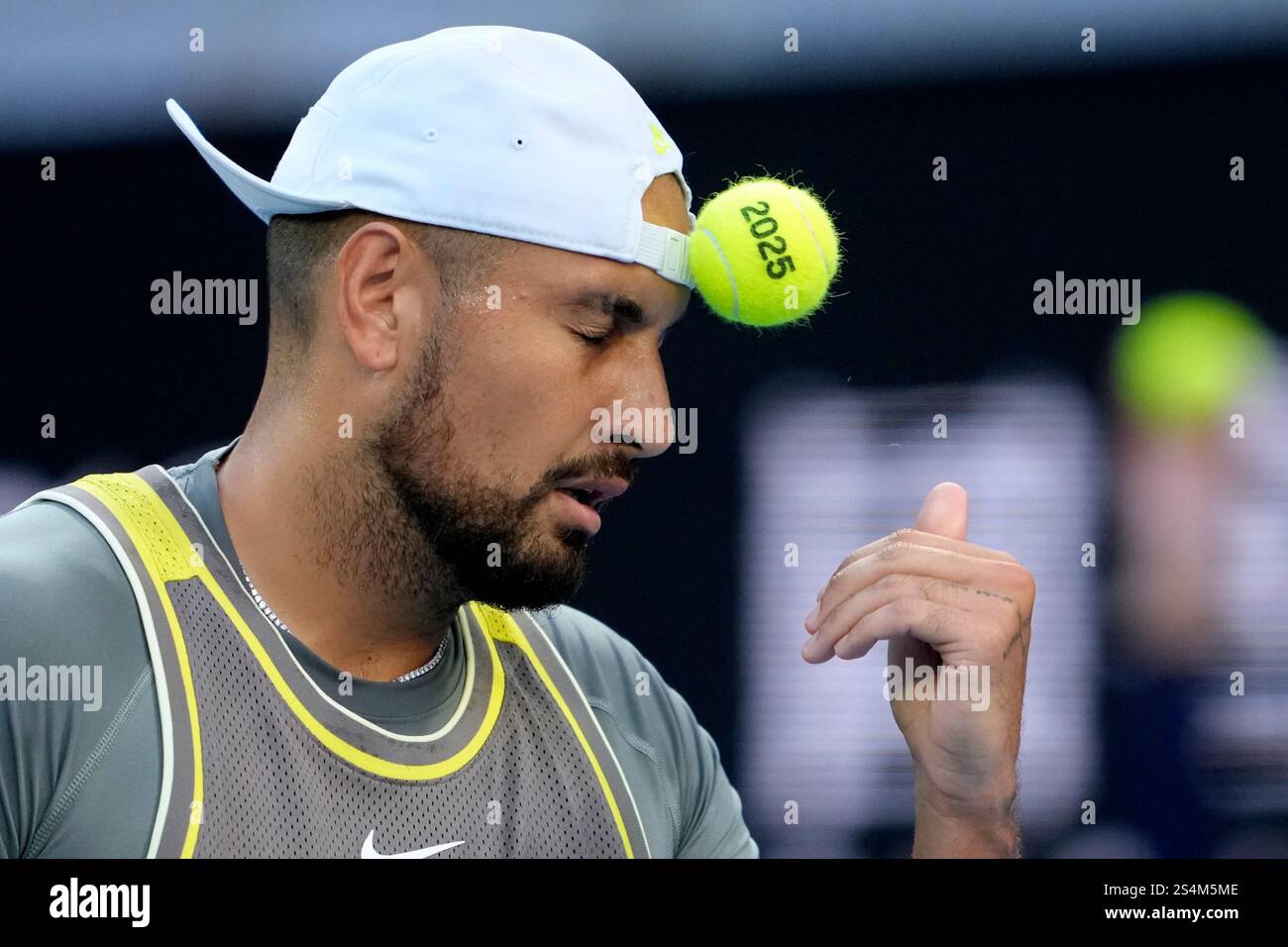 Nick Kyrgios of Australia prepares to serve to Jacob Fearnley of ...