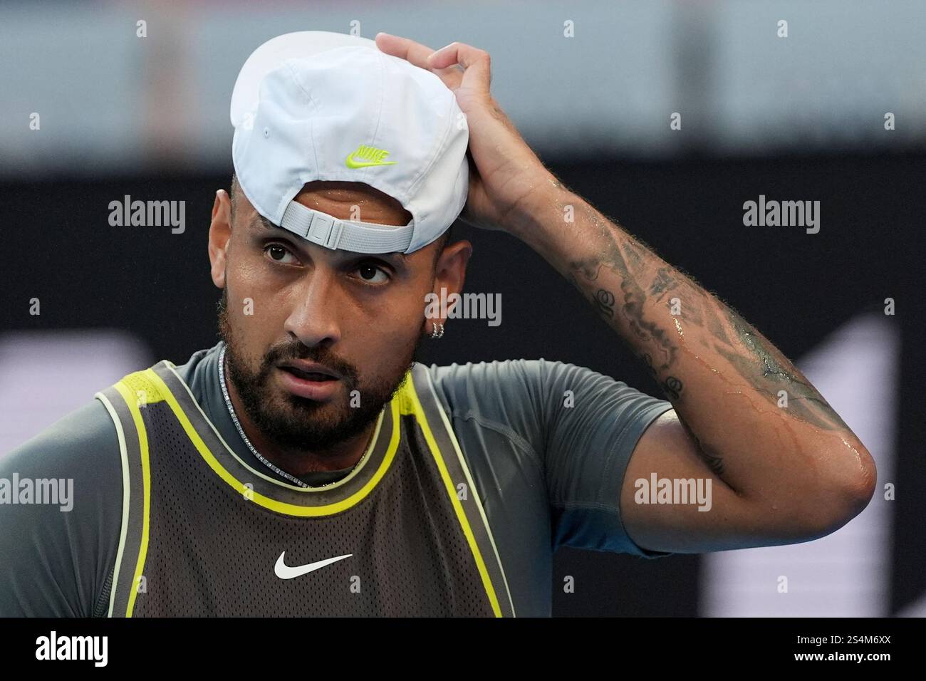 Nick Kyrgios of Australia prepares to serve to Jacob Fearnley of ...