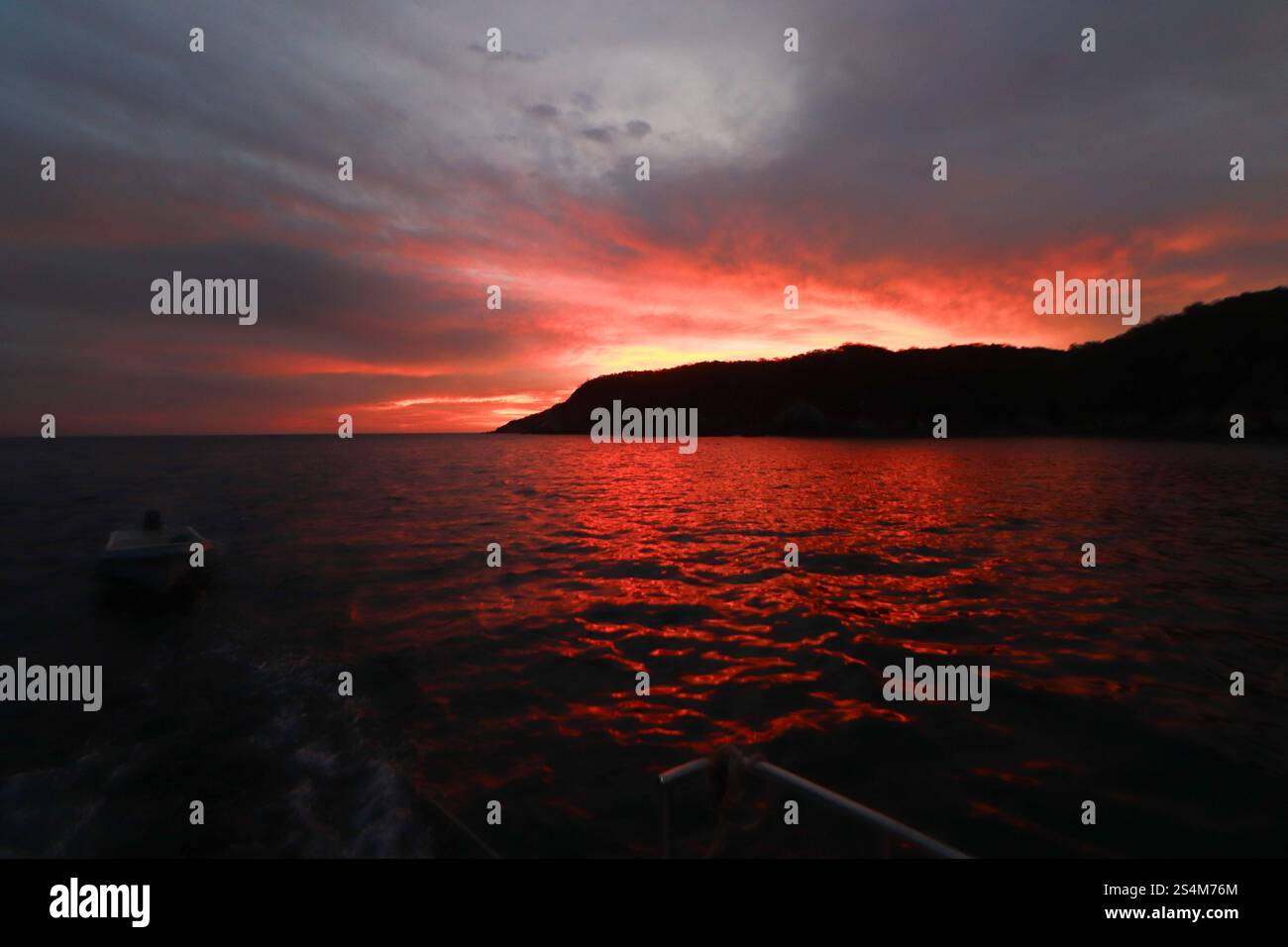 Huatulco National Reserve Mountains are seen through the sunset near ...