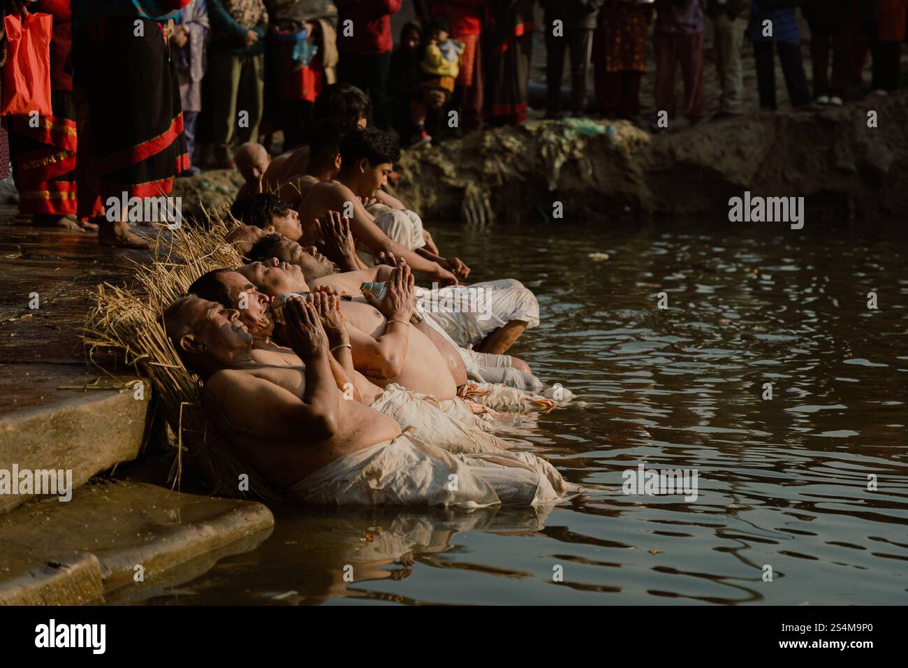 Bhaktapur, Nepal. 13th Jan, 2025. Devotees perform a religious ritual ...