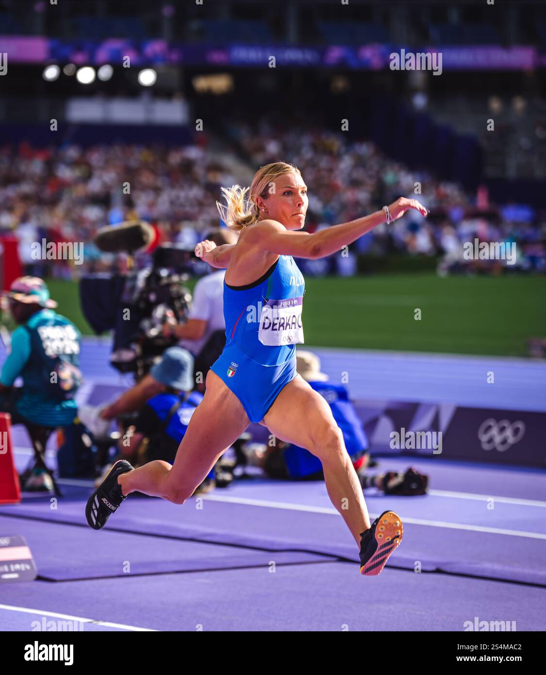 Dariya Derkach participating in the triple jump at the Paris 2024 ...