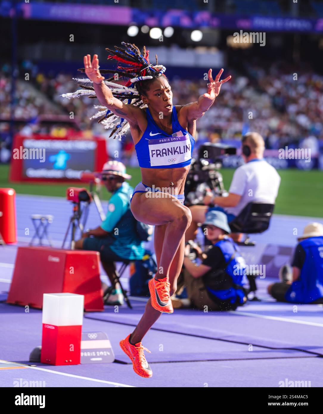 Tori Franklin celebrating her medal with her country's flag at the ...