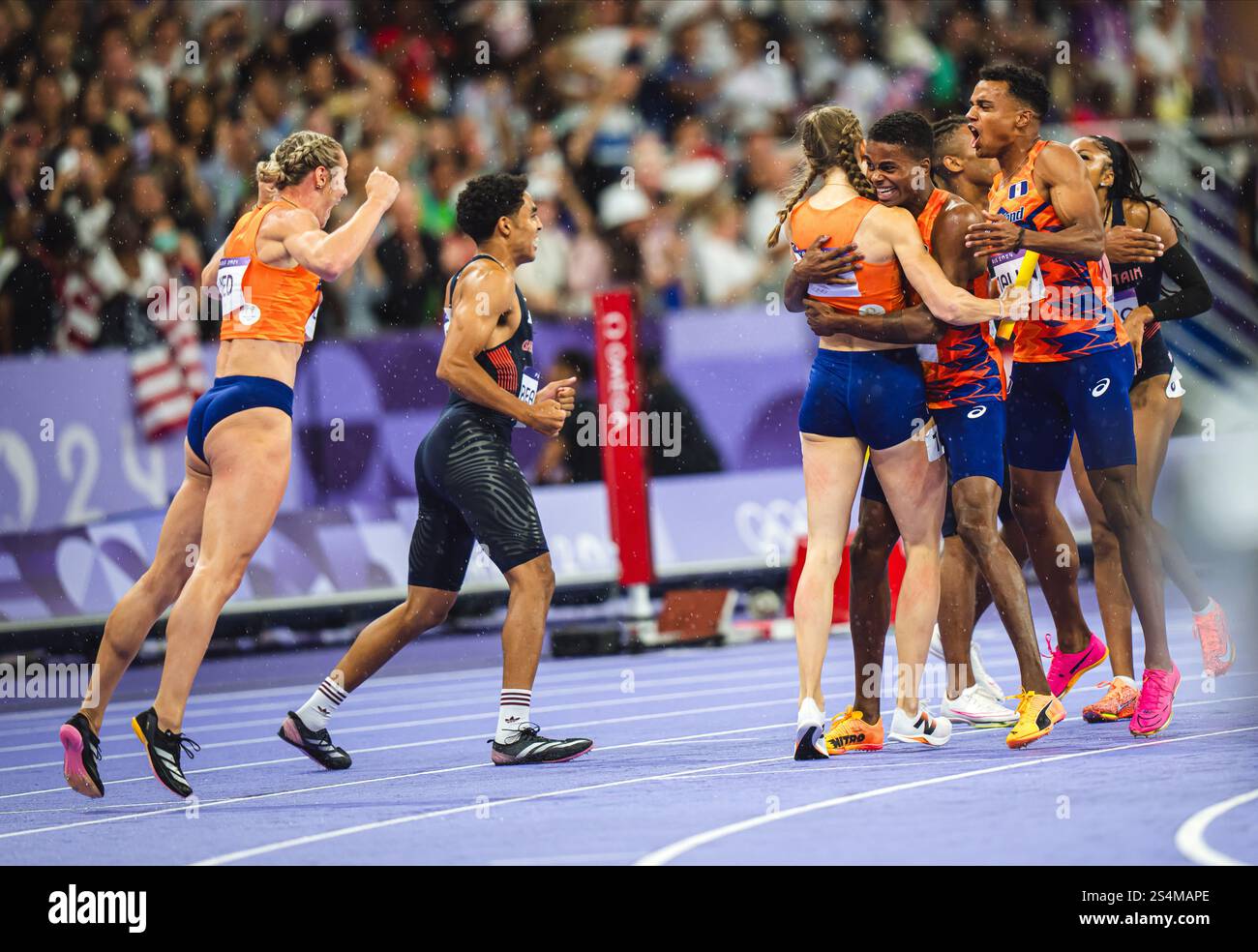 Femke Bol celebrating with her country's flag in the 4x400 meters Mix relay at the Paris 2024 ...
