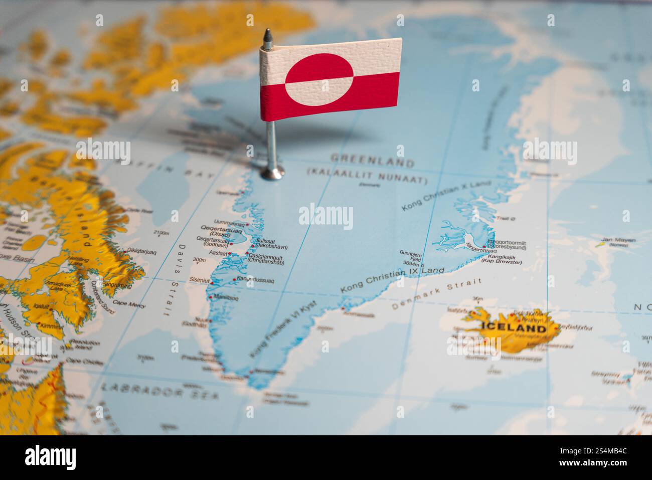 The Greenlandic flag pinpointed on a map of Greenland, representing ...