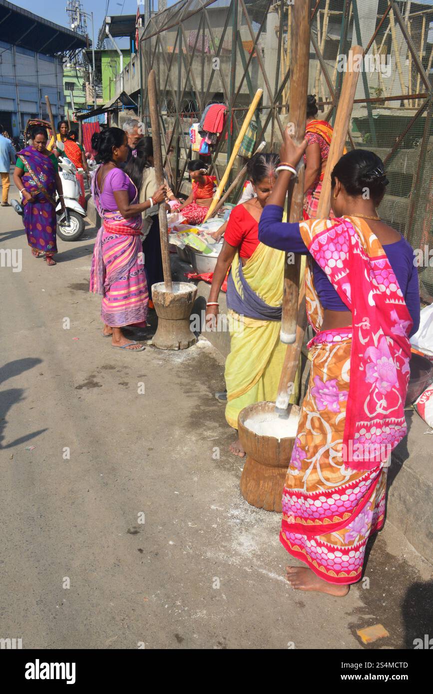 Siliguri, West Bengal, India. 13th Jan, 2025. Women make rice flour ...