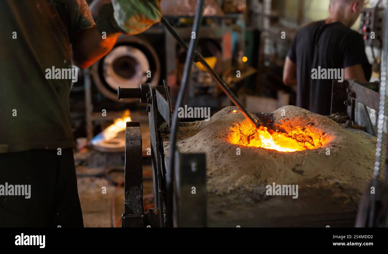 Foundry - ferrous metal is melted in an induction furnace of ...