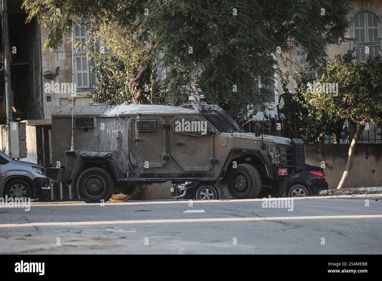 Israeli military vehicles are seen during a raid on the Ein Beit al-Maa ...