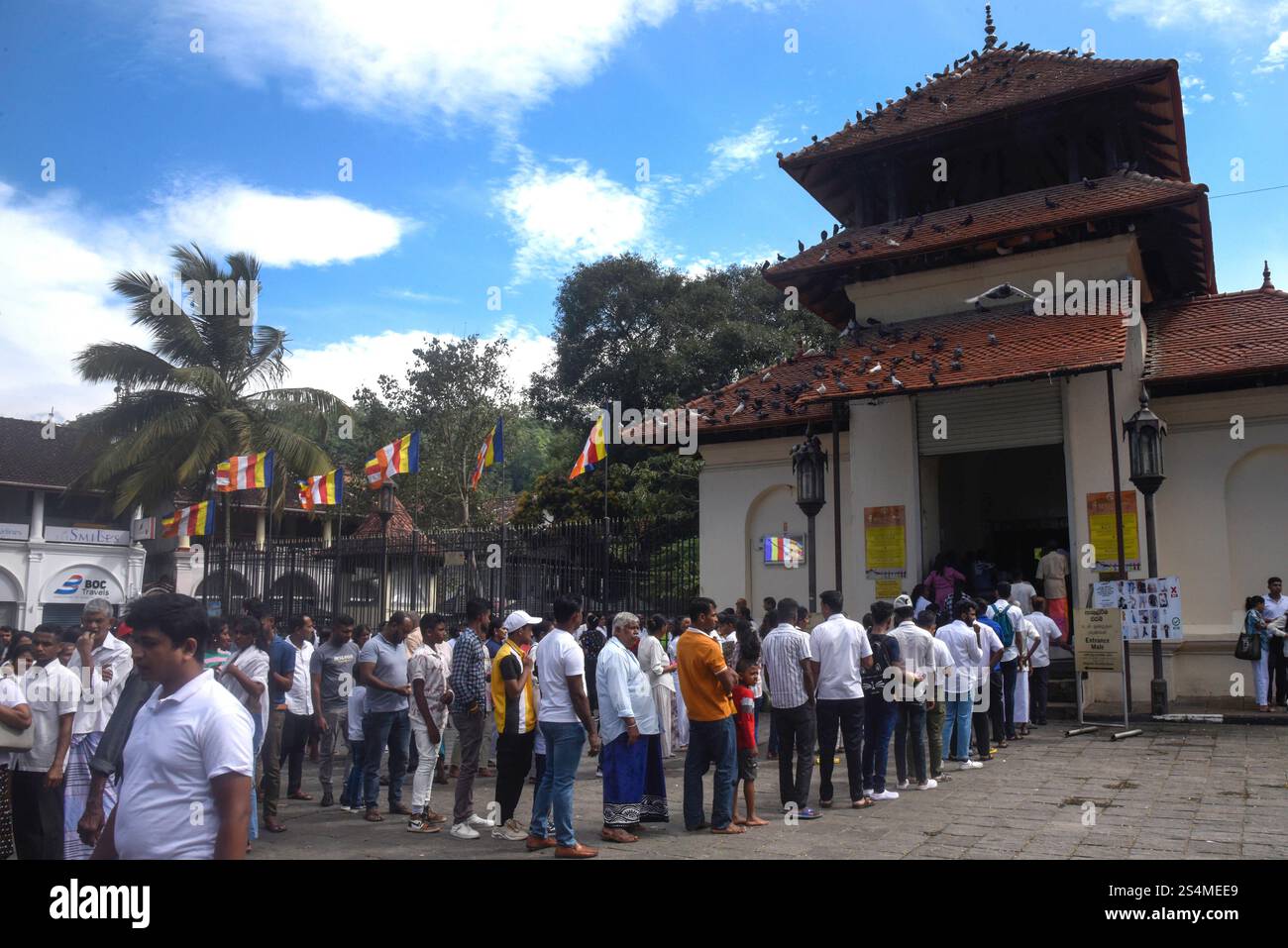 Duruthu Poya Day in Sri Lanka People queue outside of the Temple of the ...