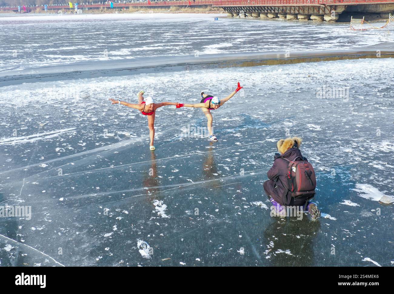 Aerial photo shows people enjoy skating on the frozen Hun River in ...