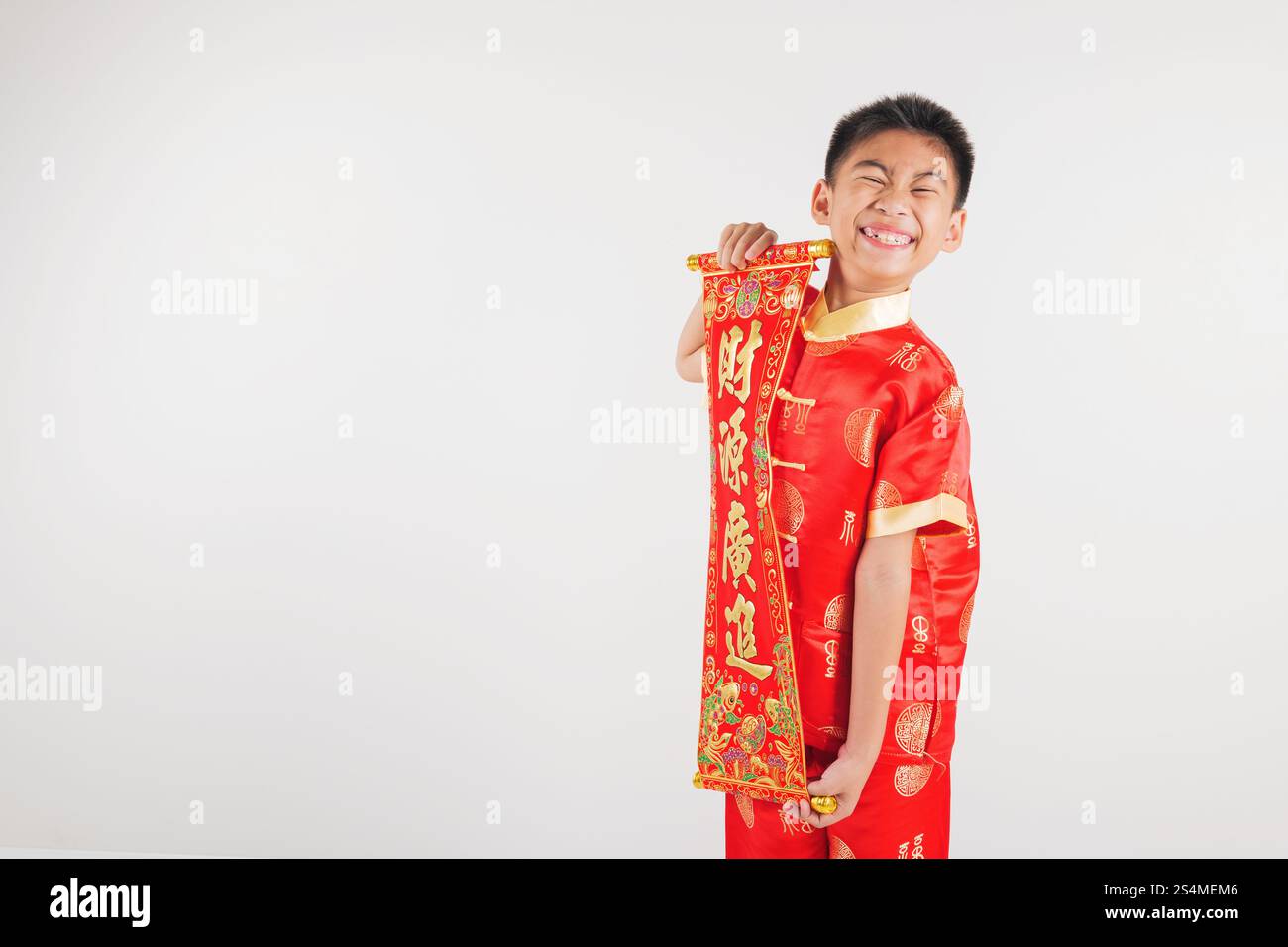 Happy Chinese New Year Little Asian boy in red qipao holding spring ...