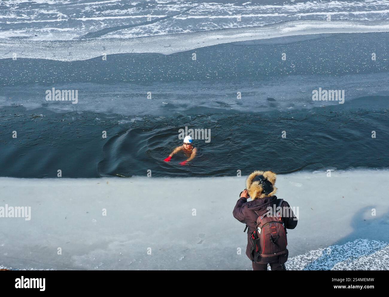 Aerial photo shows people enjoy skating on the frozen Hun River in ...