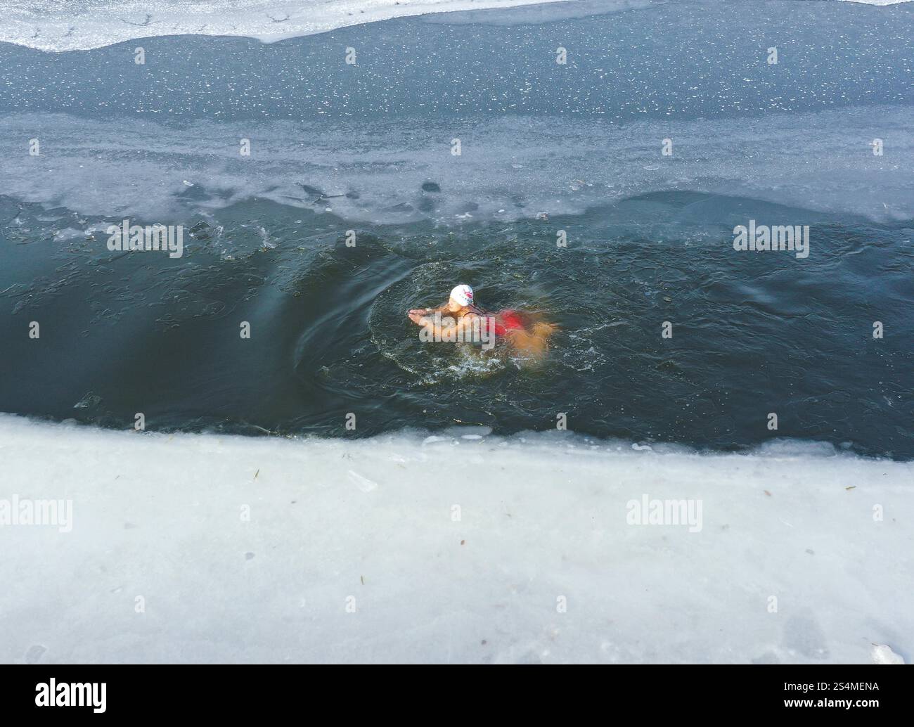 Aerial photo shows people enjoy skating on the frozen Hun River in ...