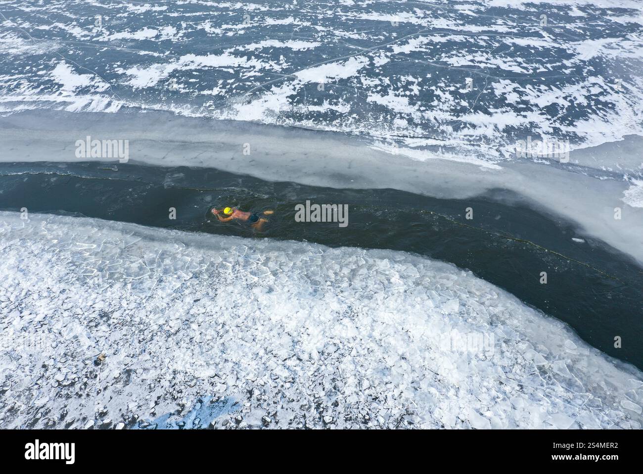 Aerial photo shows people enjoy skating on the frozen Hun River in ...