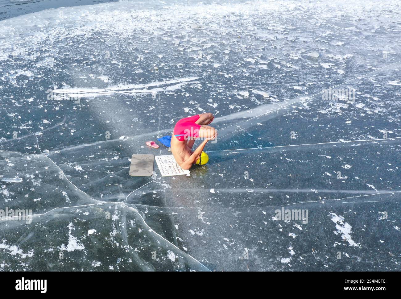 Aerial photo shows people enjoy skating on the frozen Hun River in ...