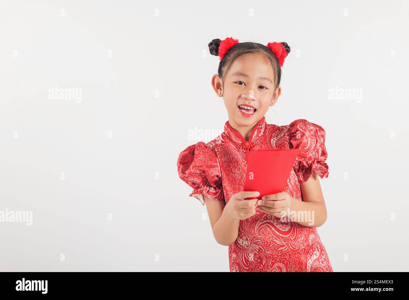 Chinese New Year. Happy Asian Chinese kid girl smile wear red cheongsam ...