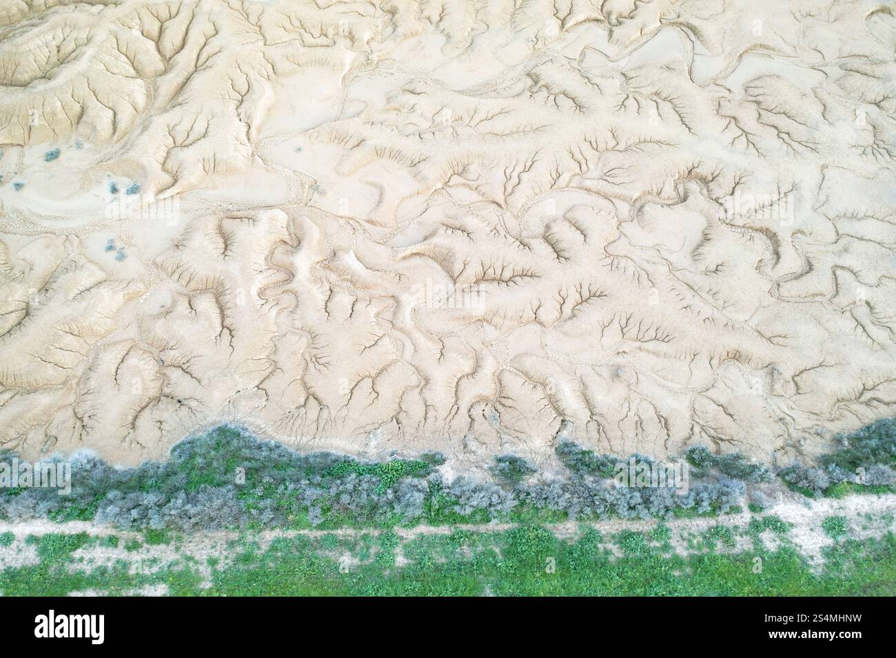 Aerial view of a uniquely textured, arid landscape showcasing patterns ...