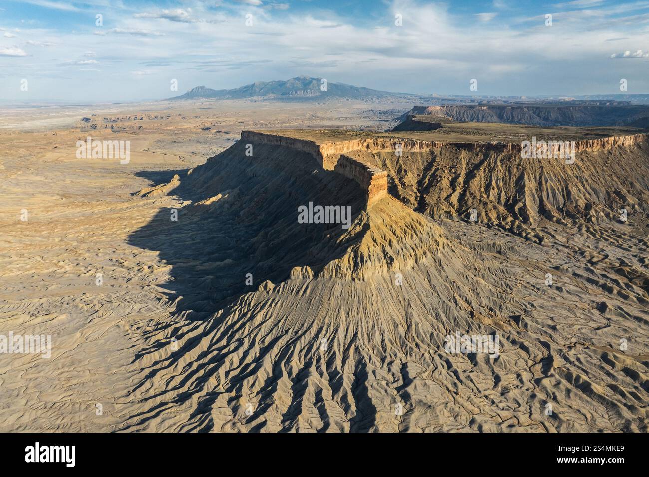 Dramatic aerial view of Caineville Mesa in Utah, USA, showcasing rugged ...