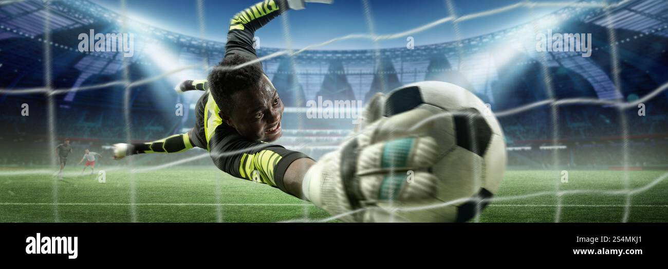 Goalkeeper in bright uniform extending his arm to catch soccer ball ...