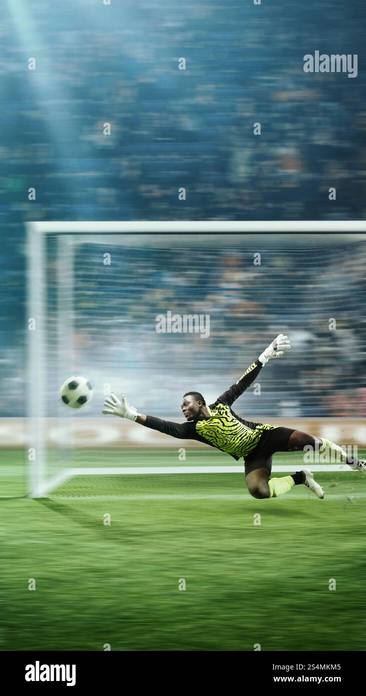 Goalkeeper in motion catching fast-moving soccer ball, with blurred ...