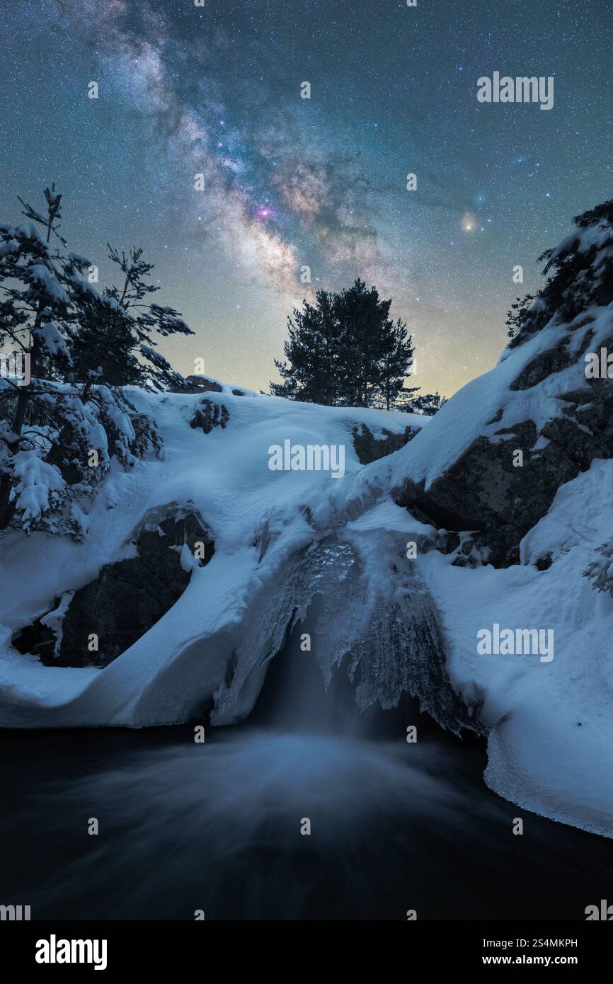 Captivating night scene depicting the Milky Way over a snow-laden ...