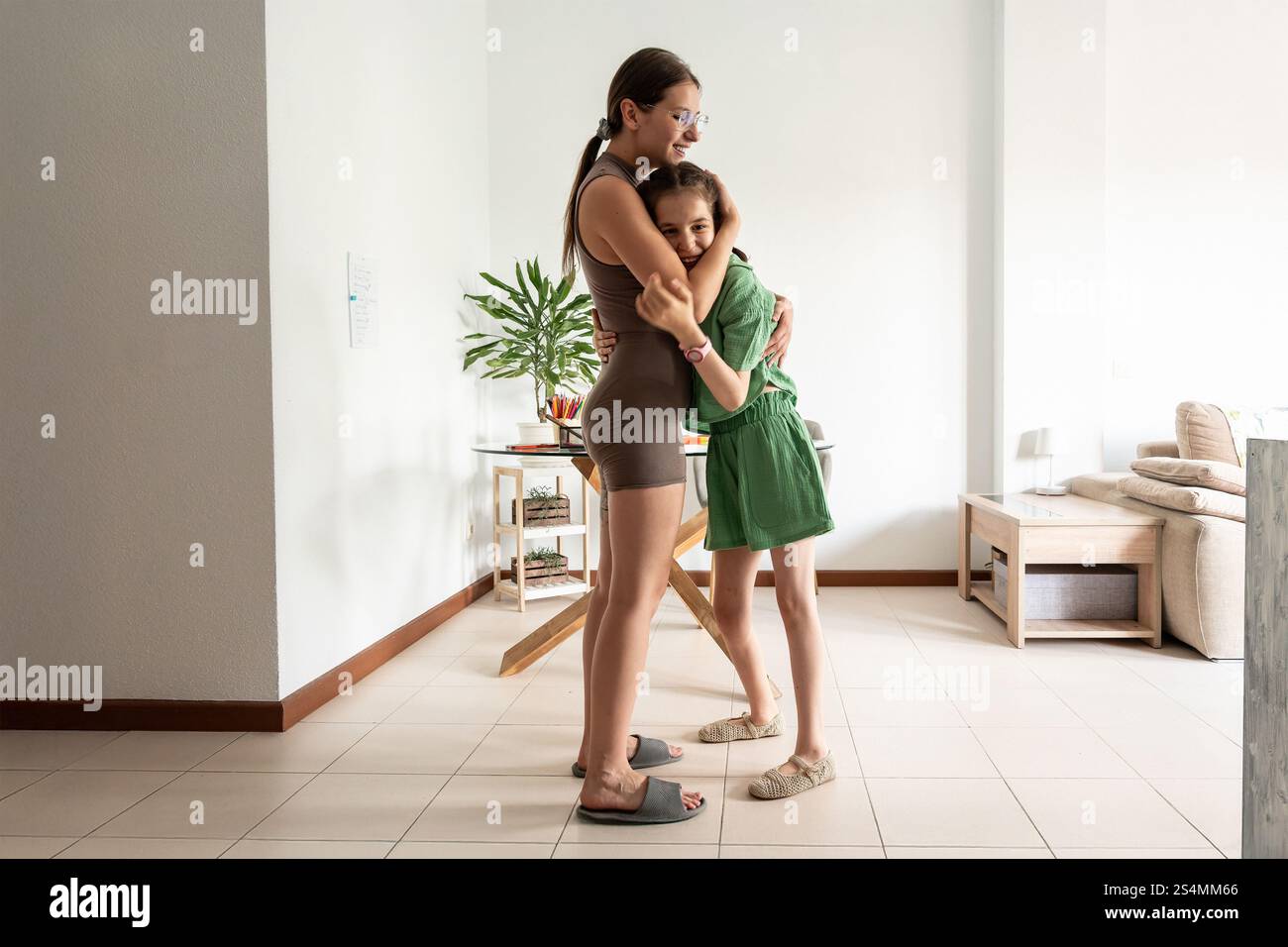 A touching moment between a young girl with a tracheostomy and her ...