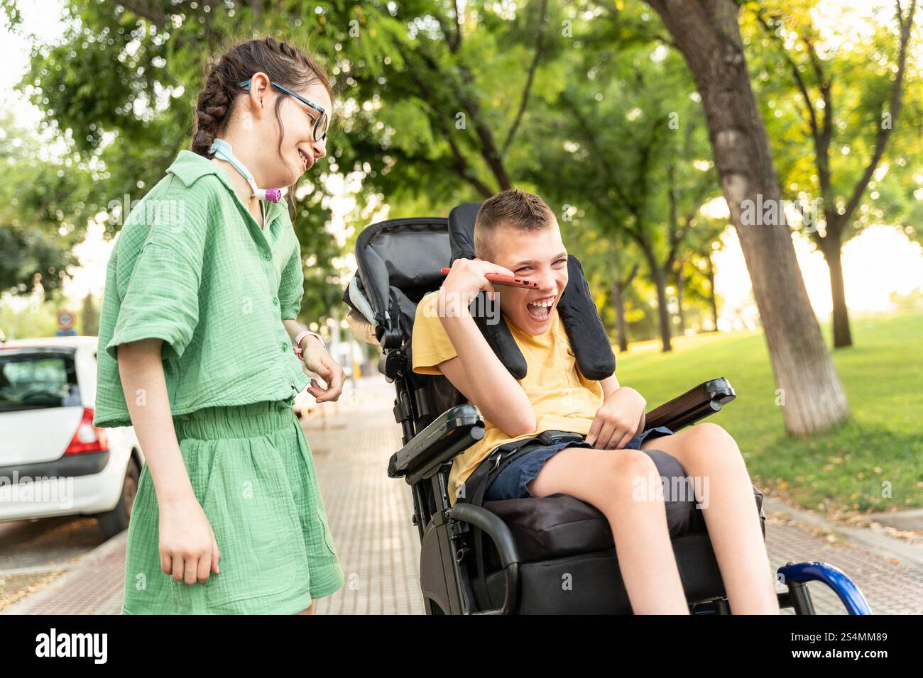 A boy with cerebral palsy and a girl with a tracheostomy enjoy a fun ...
