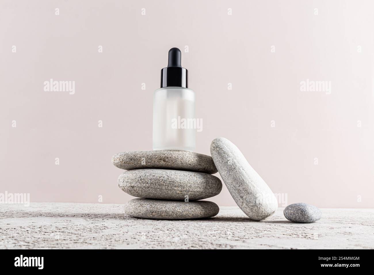 A minimalist skincare concept with a frosted glass dropper bottle ...