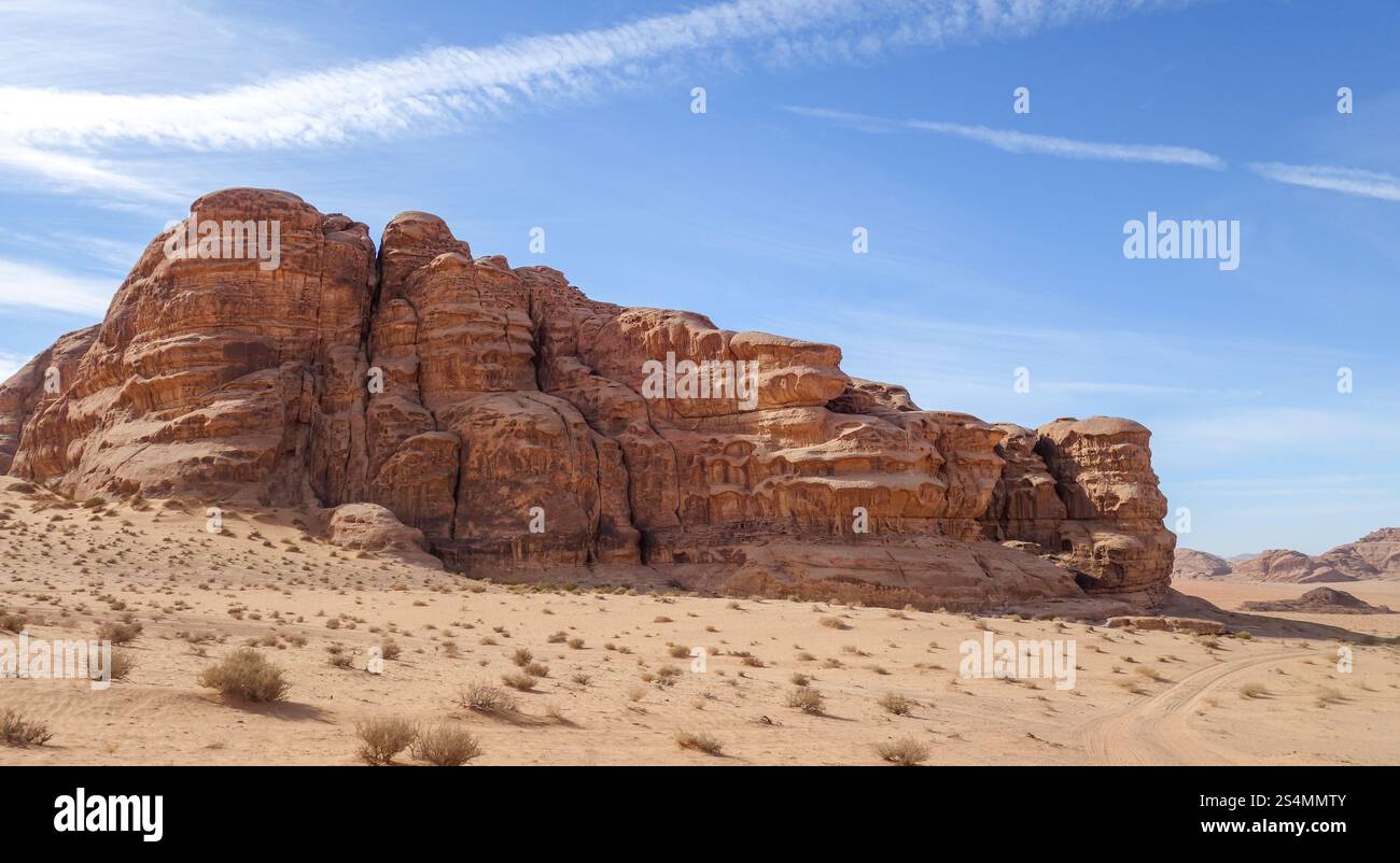 Majestic sandstone cliffs stand prominently in Wadi Rum, Jordan, under ...