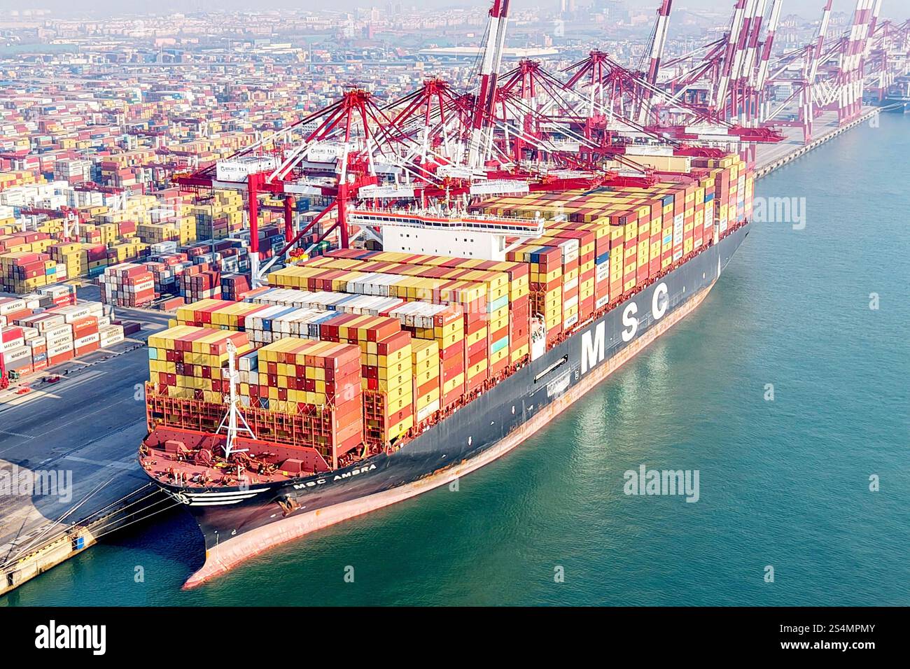 A MSC container ship gets service at a container terminal in Qingdao in ...