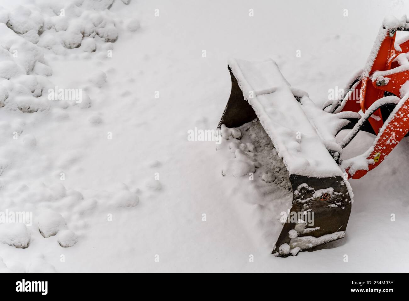 Snow-covered machinery and tracks in Oslo Stock Photo - Alamy