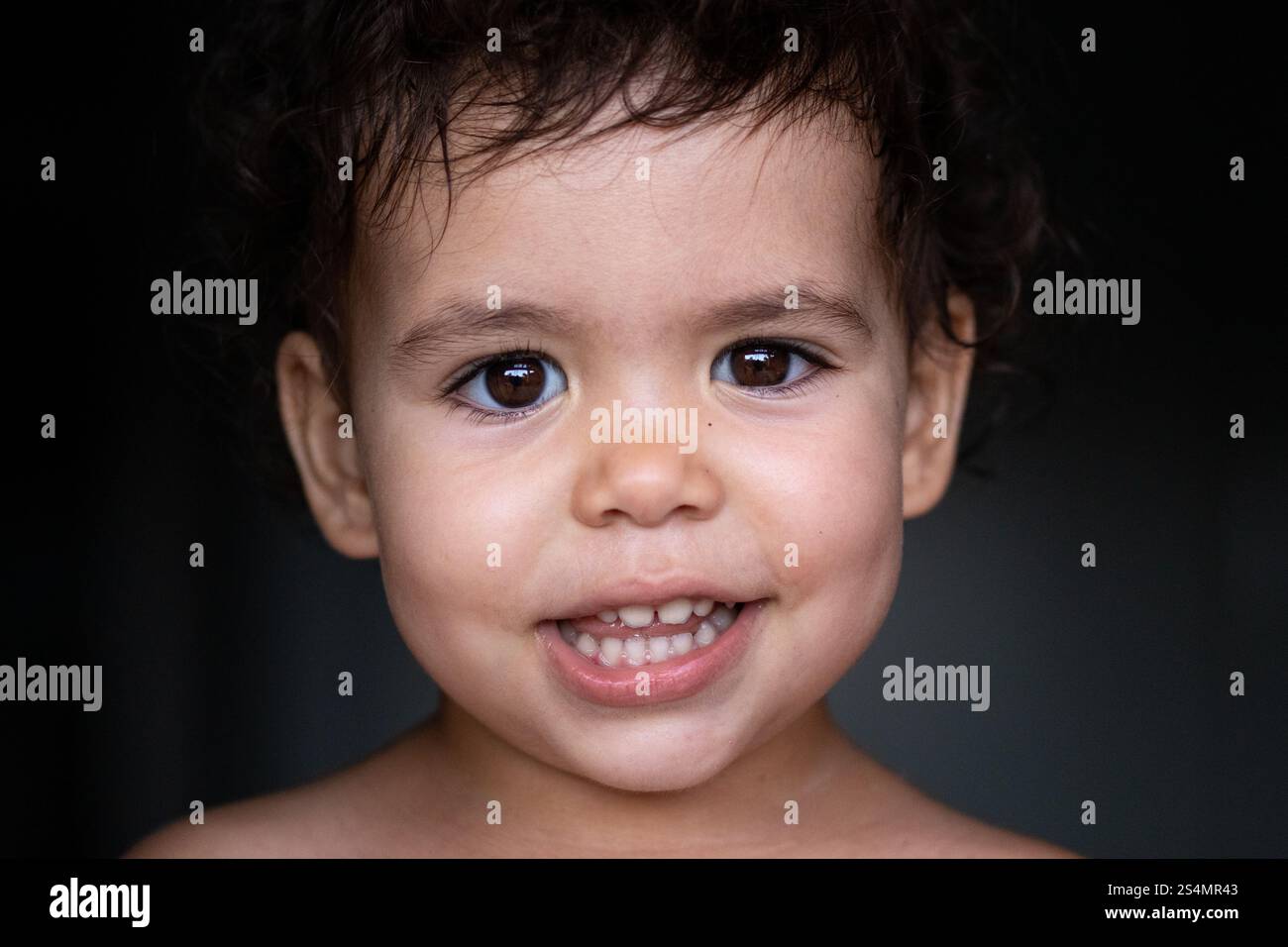 A beautiful little girl of two years old smiling in a portrait p Stock ...