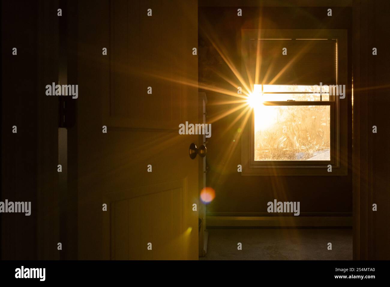 Warm late-day sunlight streaming through a bedroom window Stock Photo ...