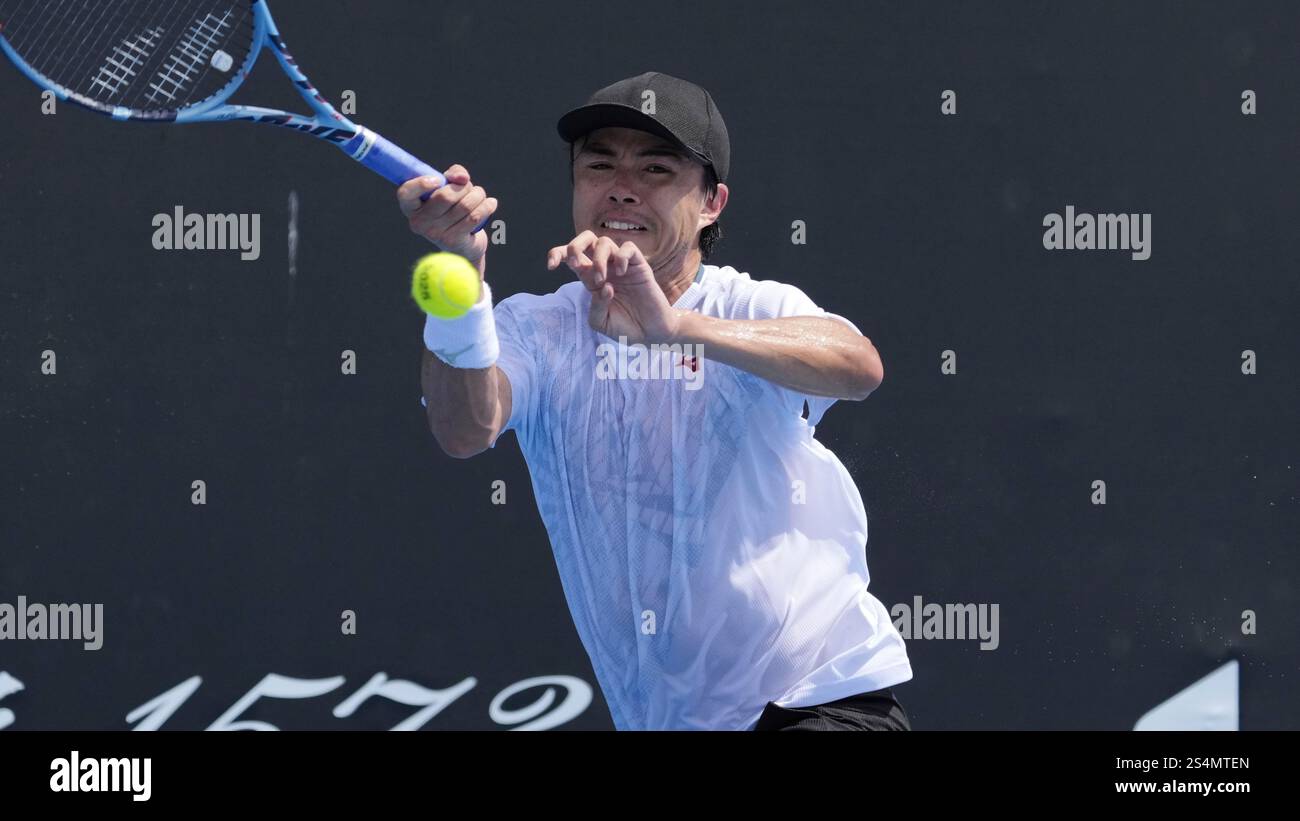 Taro Daniel of Japan plays a forehand return to Tristan Schoolkate of ...
