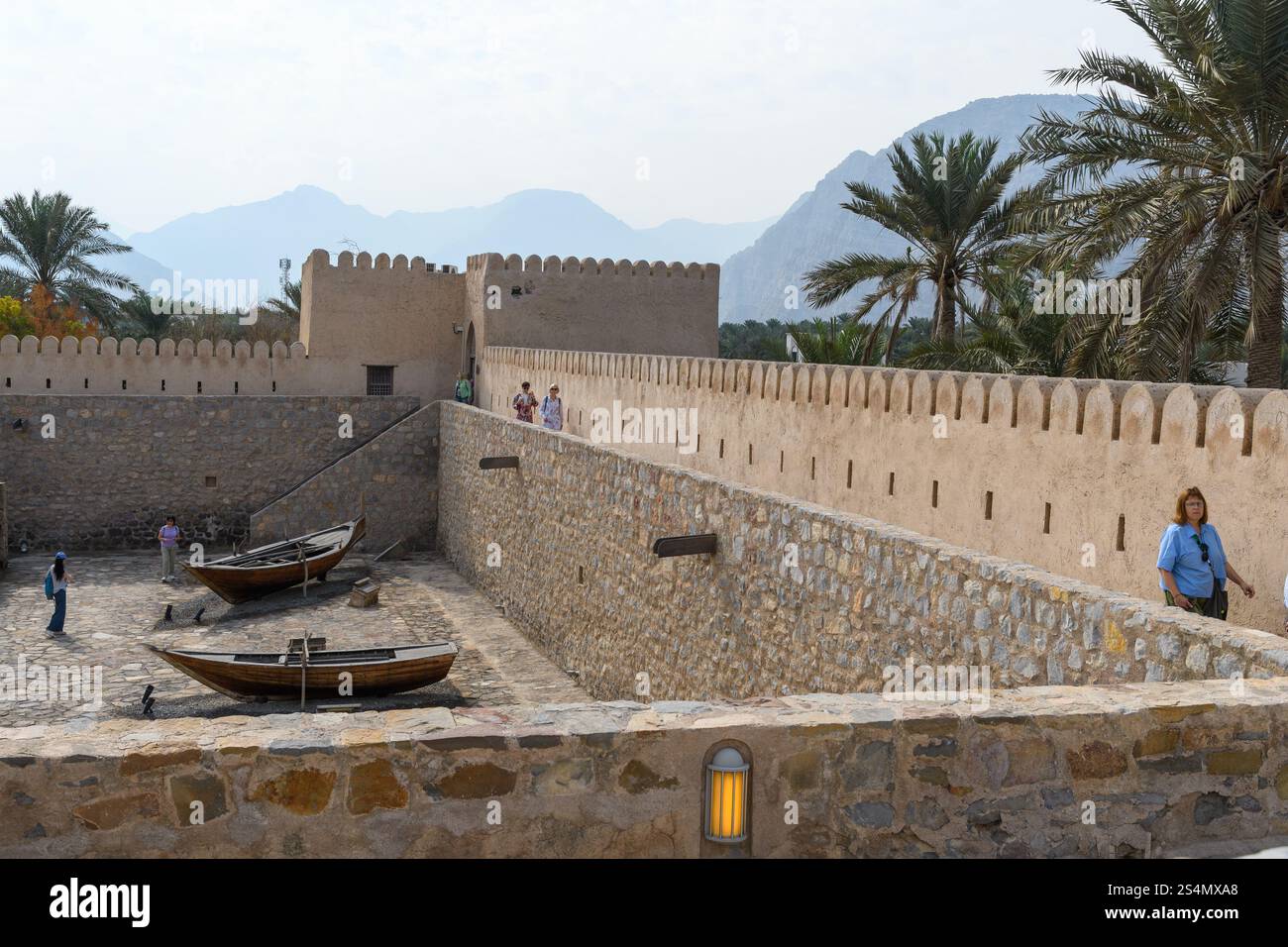 Khasab, Oman - January 1, 2025: Tourists explore the historic Khasab ...